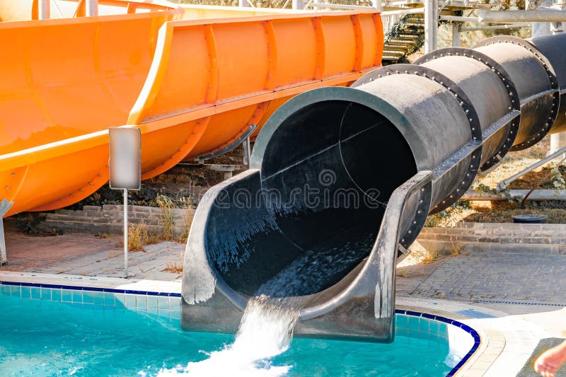 Water Flows Down Black Water Slide in Water Park Stock Image - Image of ...
