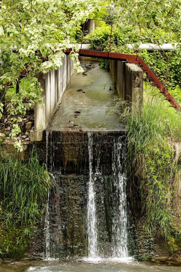 Water Flows Down a Concrete Drain into a River Stock Image - Image of ...