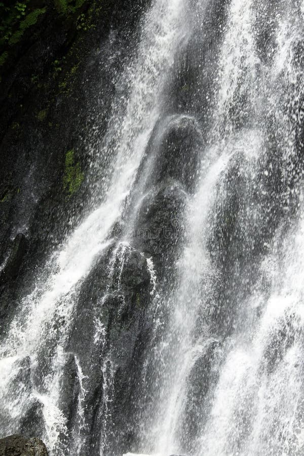 The Water Flows Down from the Rock Cliff Stock Image - Image of ...