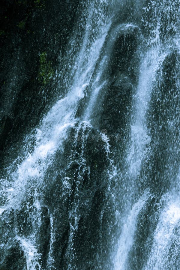 The Water Flows Down from the Rock Cliff Stock Photo - Image of ...