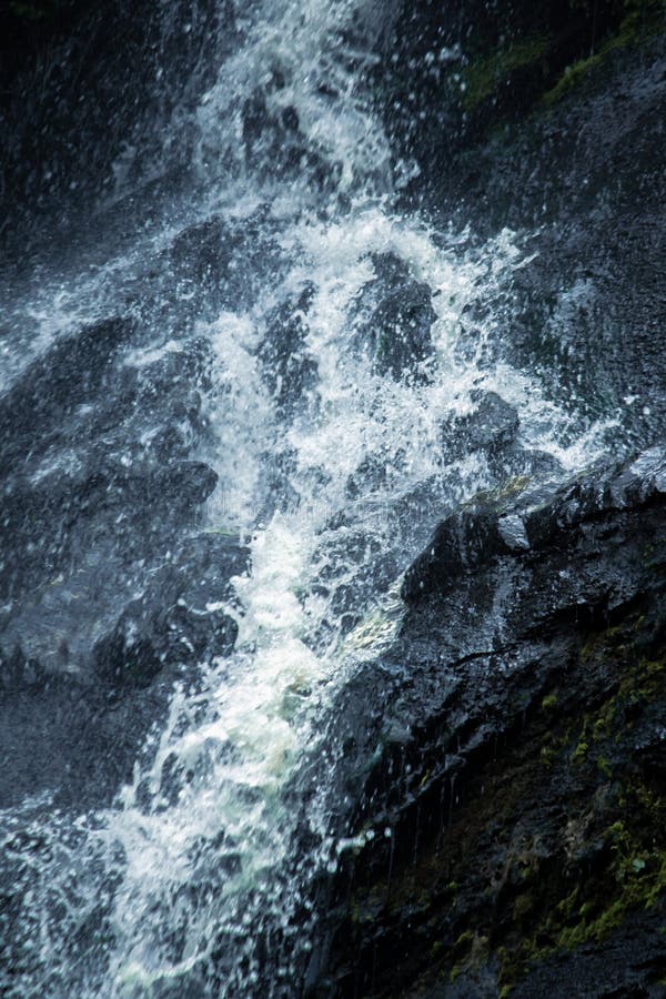The Water Flows Down from the Rock Cliff Stock Image - Image of color ...