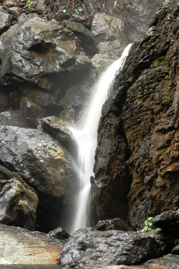 The Water Flows Down from the Rock Cliff Stock Photo - Image of ...