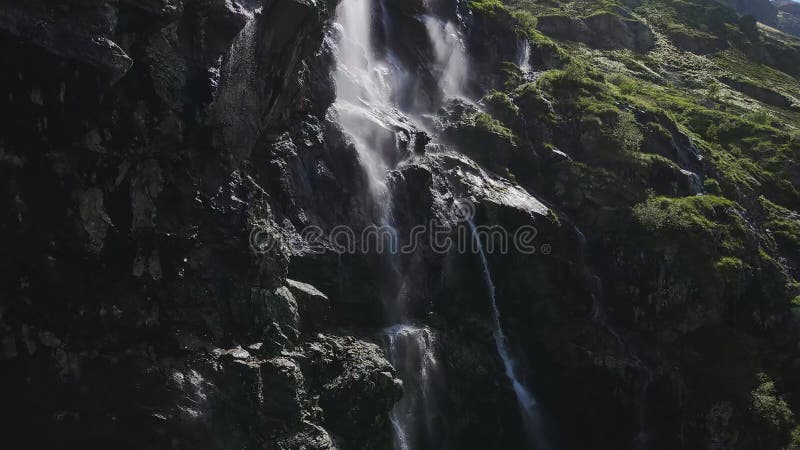 Water Flows Down the Slope of a Mountain Drops Splash from a Huge Rock ...