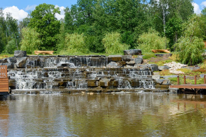 Water Flows Down Stone Steps in a Cascading Waterfall in the Park ...