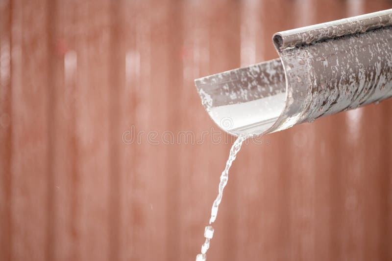 Water Flows through the Drain Pipe. Snow is Melting Stock Image - Image ...