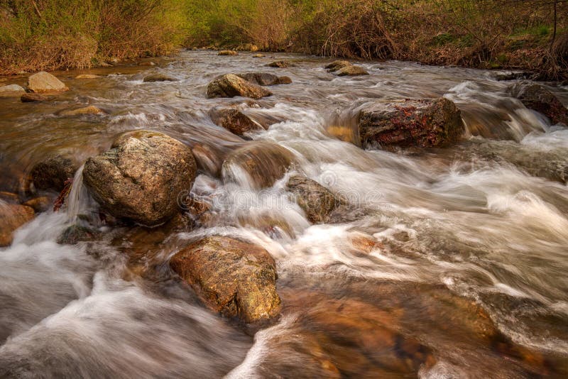 The Water Flows Over Numerous Large, Rounded Rocks Stock Image - Image ...