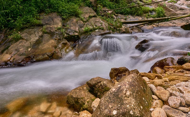Water Flows Over Rocks in a Little Waterfall. Stock Photo - Image of ...