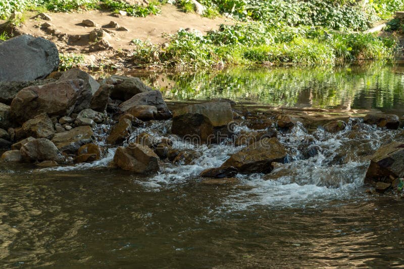 Water Flows Over Rocks in a Mountain River Stock Image - Image of ...