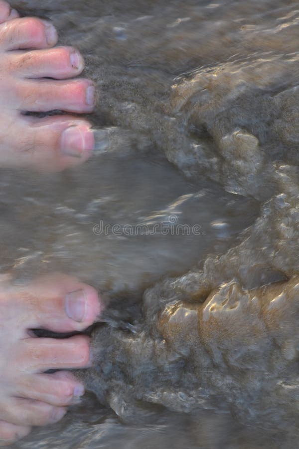 Water Flows Over Toes and Sand Stock Image - Image of ripple, hair ...