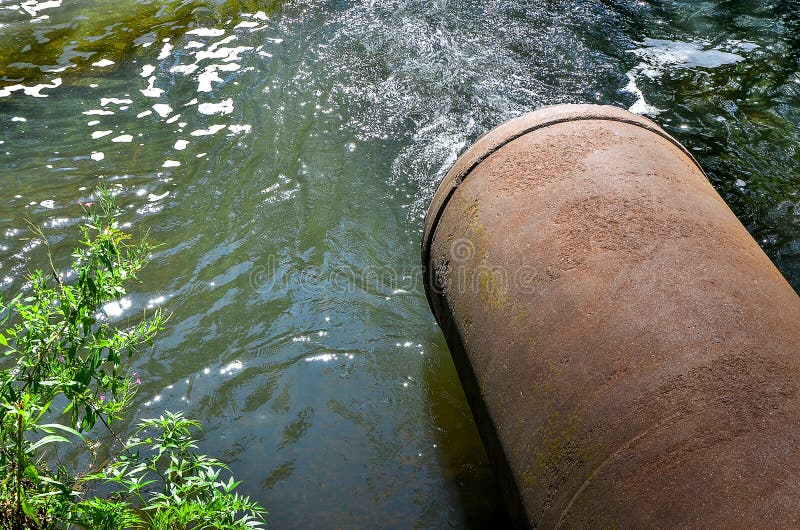 Water Flows from the Pipe into the River. Stock Photo - Image of ...