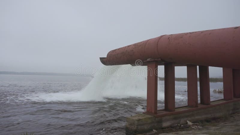 Water flows from a pipe stock footage. Video of danger - 202443832