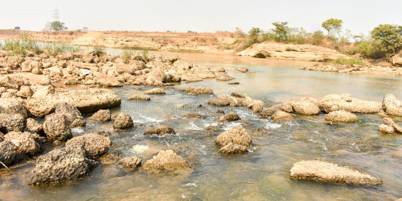 River Water Flows in between the Small Rocks Stock Photo - Image of ...