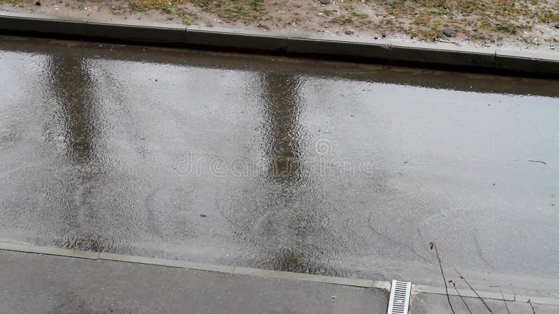 Water Flows in a Stream on the Asphalt on the Road during the Rain ...
