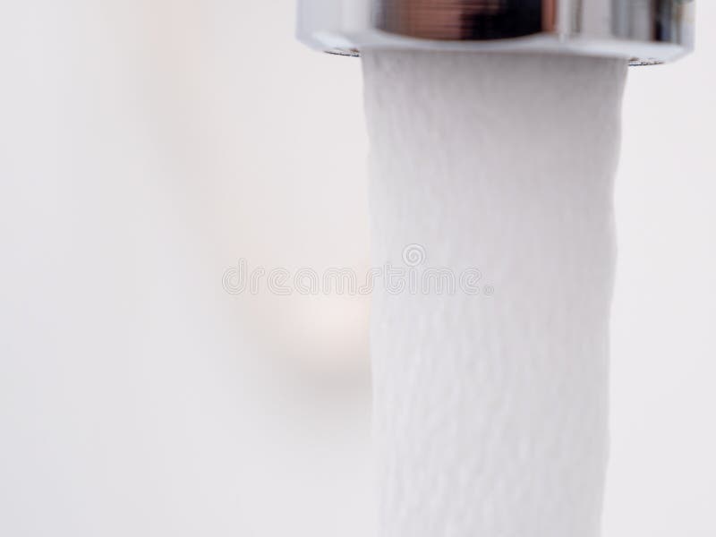 Water Flows from a Tap, Water Pressure on a White Background. Stock ...