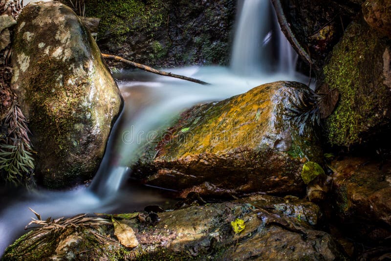 Water folling on a rock stock image. Image of rock, water - 185580241