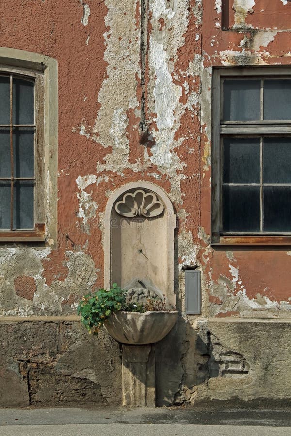 Water Fountain in Front of the Facade of a Decaying Building Stock ...