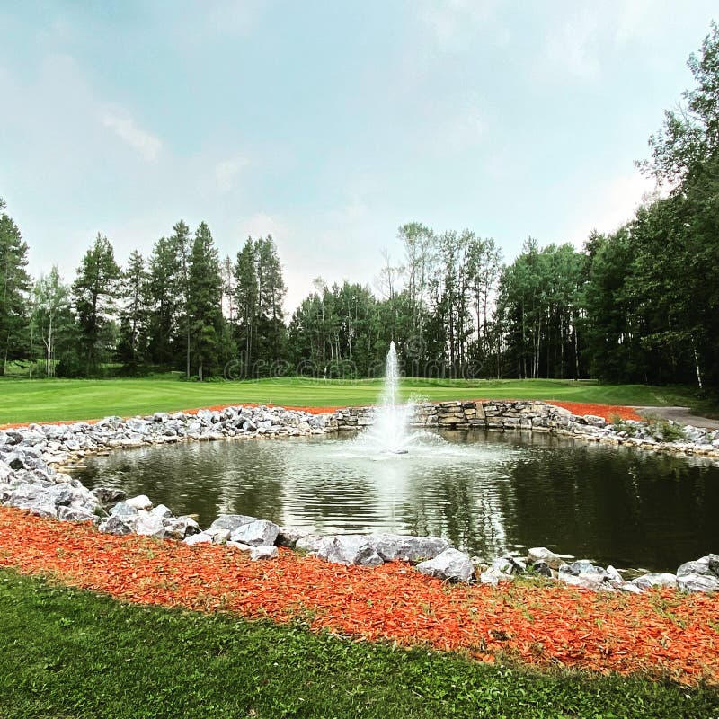 Water Fountain on a Golf Course in Alberta Stock Image - Image of ...