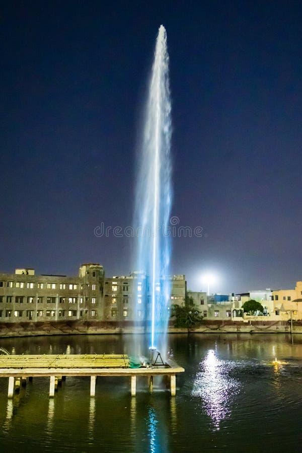 Water Fountain with Long Water Throw at Night Stock Image - Image of ...