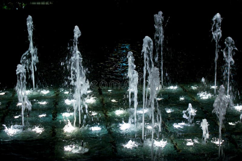 Water fountain at night stock photo. Image of lights - 17429016
