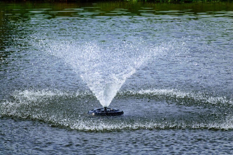 Water fountain in the pond stock image. Image of exterior - 94598831