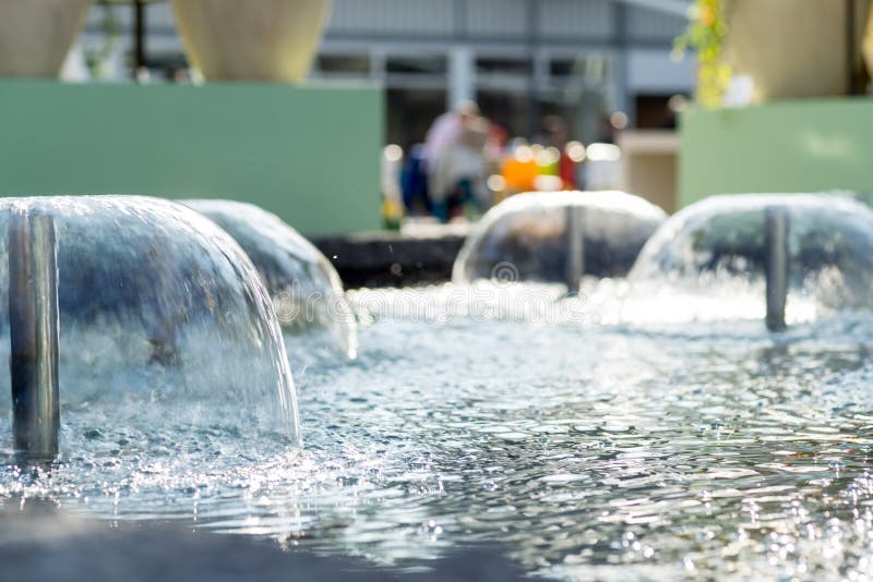 Water Fountain in a Pond with Reflection of the Sunlight Stock Photo ...