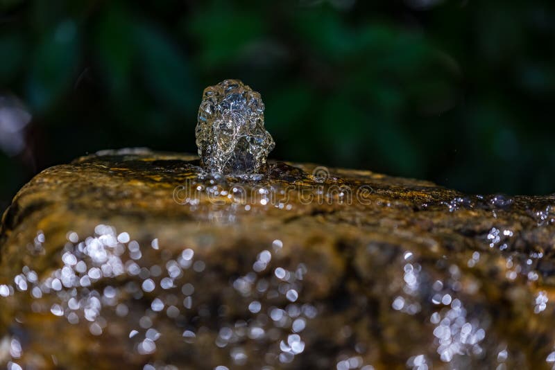 Water Frozen in Motion Gushes Out of a Water Stone Stock Photo - Image ...