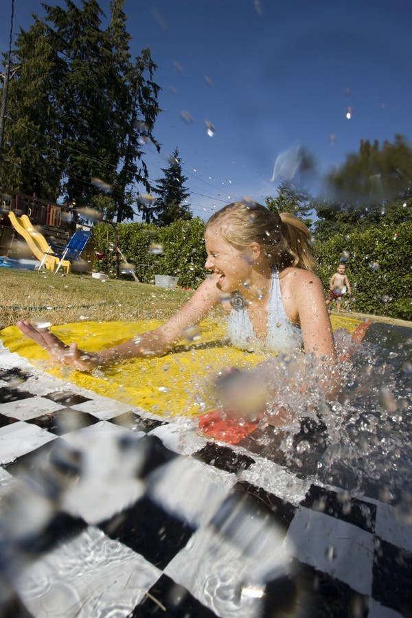 Water fun with young girl stock image. Image of playful - 10708719