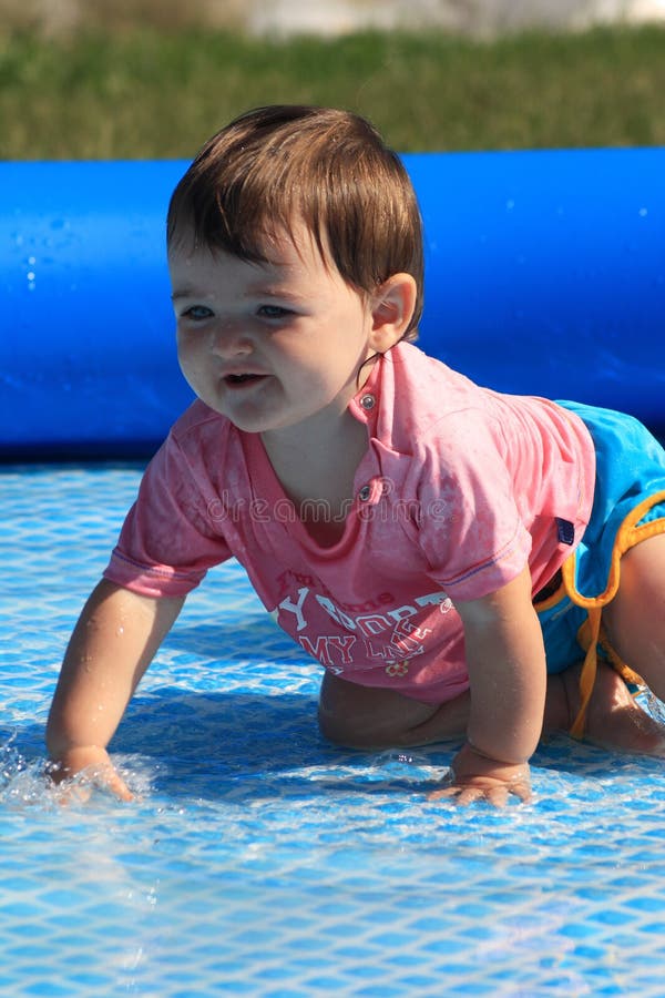 Child in the pool stock photo. Image of yellow, playing - 2801136