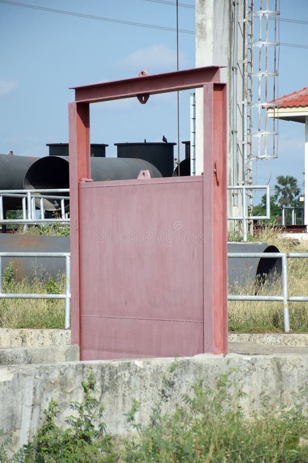 Water gate at dam stock photo. Image of rural, gate, cement - 97066042