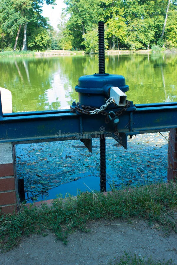 Water gate from the pond stock image. Image of river - 100233503
