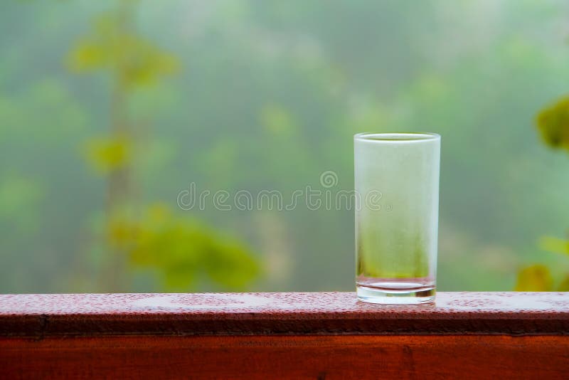 Water Glass and Flower Pot on the Wooden Deck. Stock Image - Image of ...