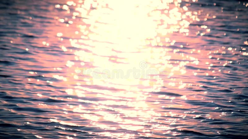 Water Glittering in Sunlight with Sun Path on Purple and Blue Water ...