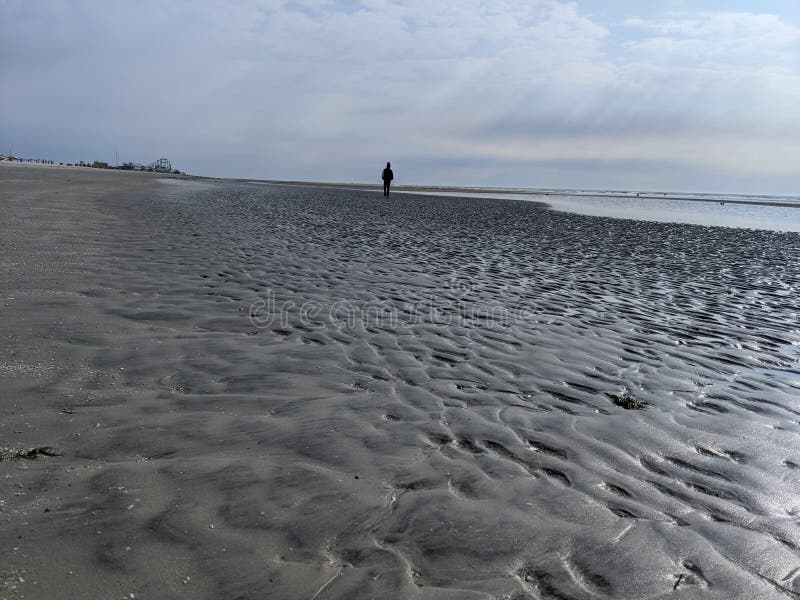 Water Going Out To Ocean on Sandy Beach Stock Photo - Image of snow ...