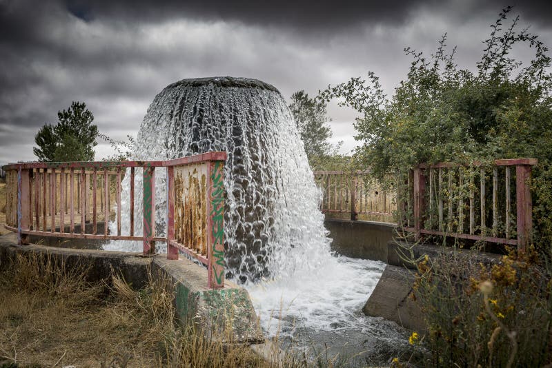 Water Gushes from Pipe To Feed an Irrigation Watercourse Canal Stock ...