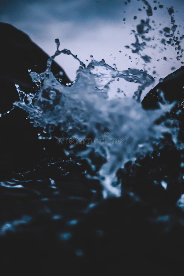 Water Hitting Rocks And Small Drops Splash Into The Camera Stock Image ...