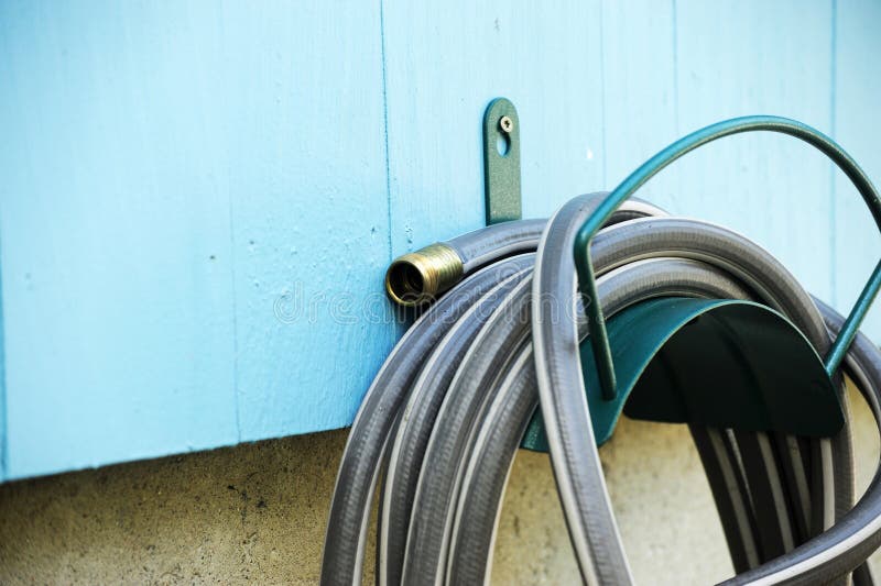 Water Hose Circled by the House Side Stock Photo - Image of spiral ...