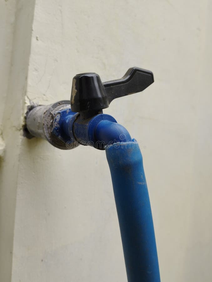 Water hose and faucet stock image. Image of purple, wood - 258920731