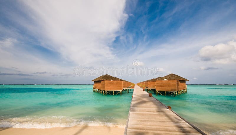 Water huts at the beach stock image. Image of bridge - 11253841