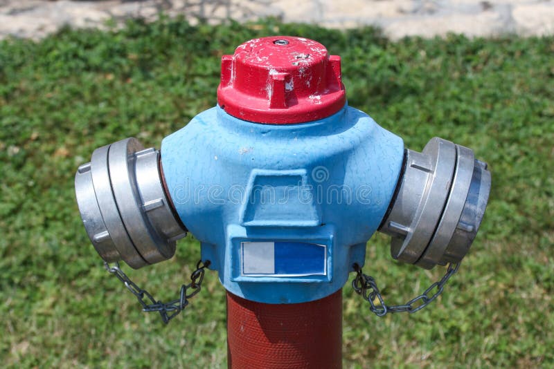 Blue and red water hydrant stock image. Image of valve - 191684031