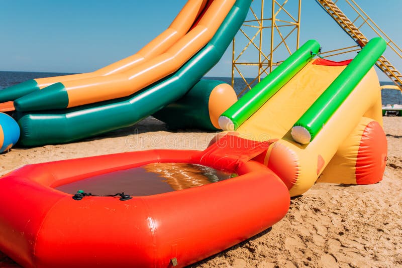 Water Inflatable Slide Attraction. Recreation Concept on the Water ...
