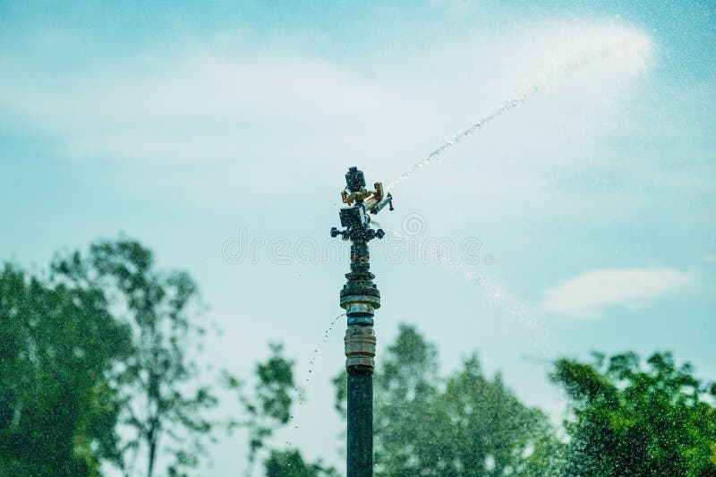 Water Irrigation Impact Sprinkler in Operation in Field Stock Photo ...
