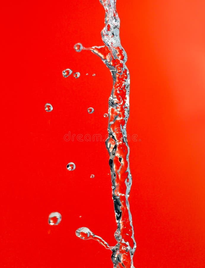 Water Jet on a Red Background Stock Photo - Image of salute, fire: 89671920
