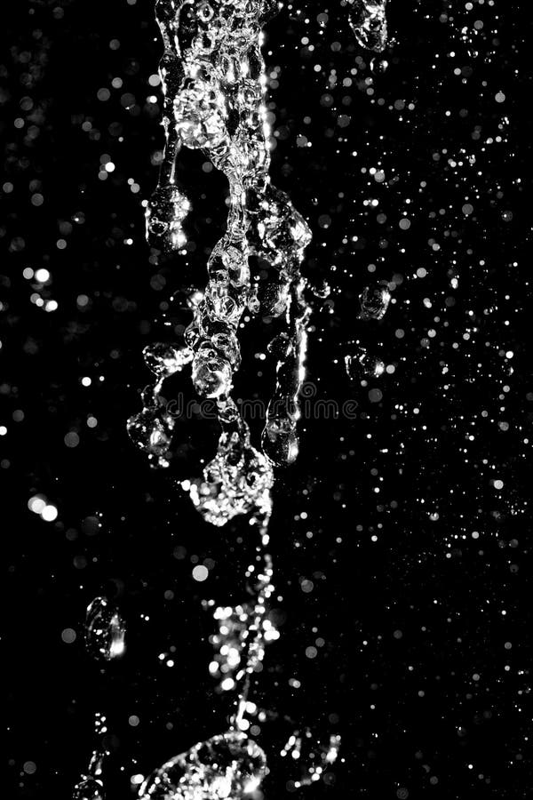 Water Jet with Spray on a Black Background Stock Image - Image of white ...