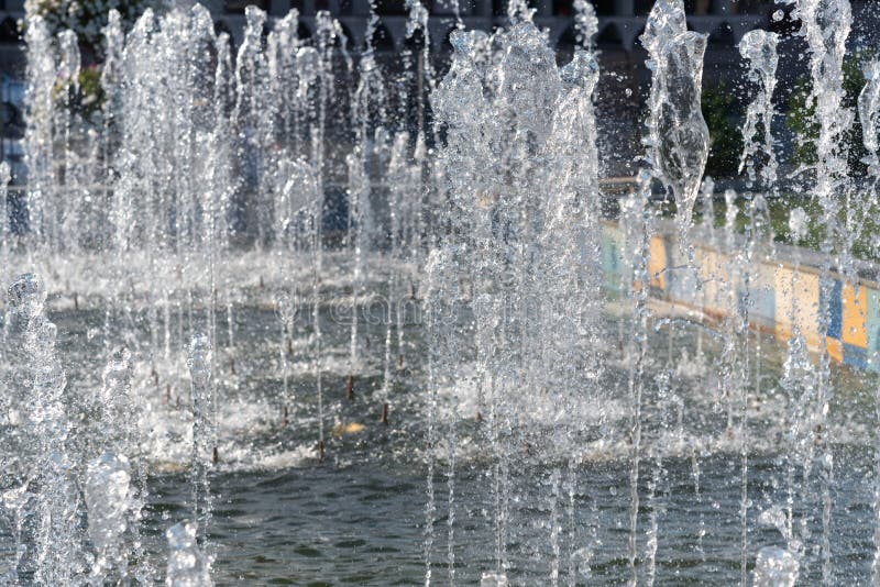 Water Jets and Splashes in the Fountain, Background. Stock Image ...