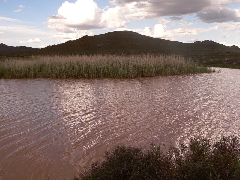 Water & land stock photo. Image of hill, grass, reflextion - 575674