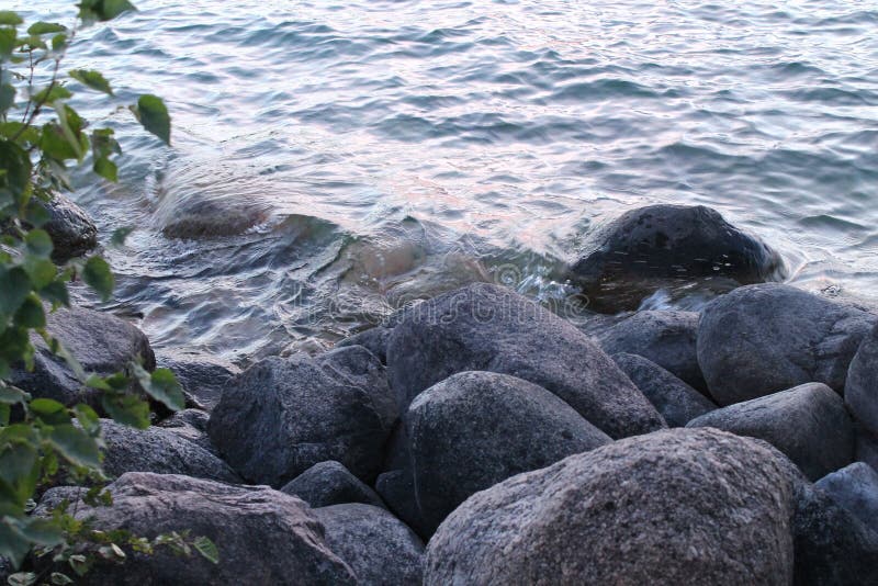 The Waves Lapping On The Rocks Stock Image - Image of seascape, rock ...