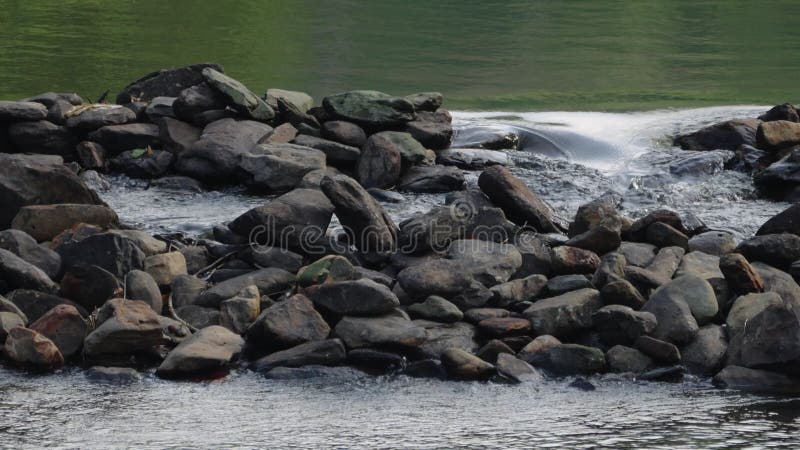Water Leaking through Rocks at a Makeshift Dam. Stock Video - Video of ...