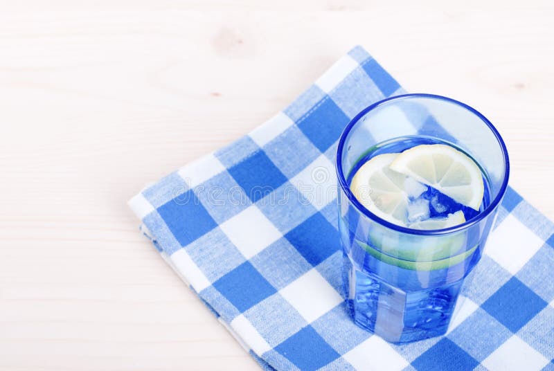 Water with Lemon and Mint in Blue Glass on the Table Top View Stock ...