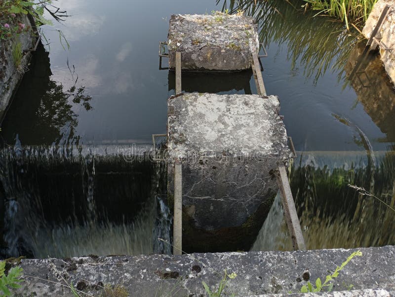 Water Level Control in the Reservoir. Old Concrete Double Sluice on the ...