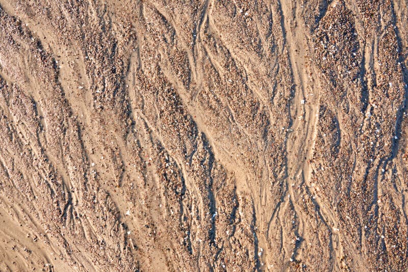 Water lines in beach sand stock photo. Image of wood - 214586084